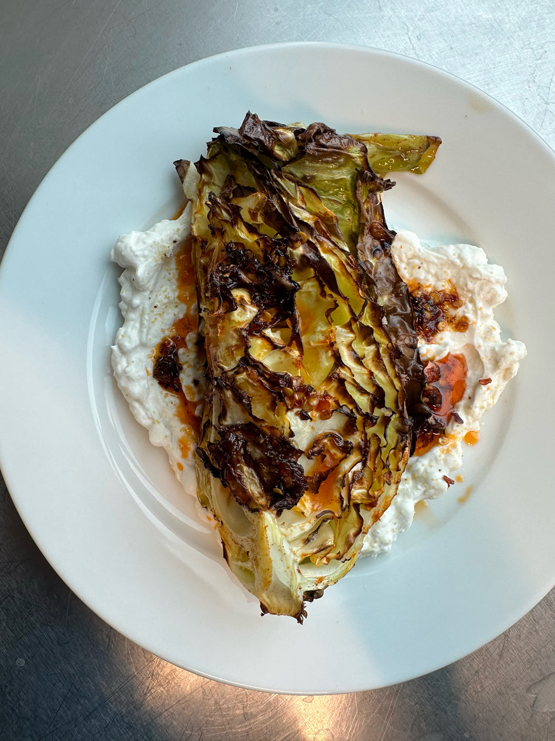 GRILLED HISPI CABBAGE W. SUPERSTRACCIA & CHILLI OIL – JULIENNE BRUNO